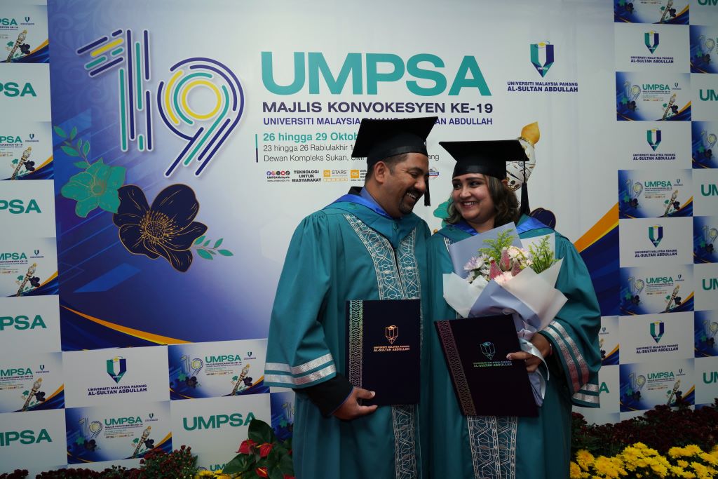 Sanjay and Devapriyaa, husband and wife, share the stage at the 19th UMPSA Convocation Ceremony ...
